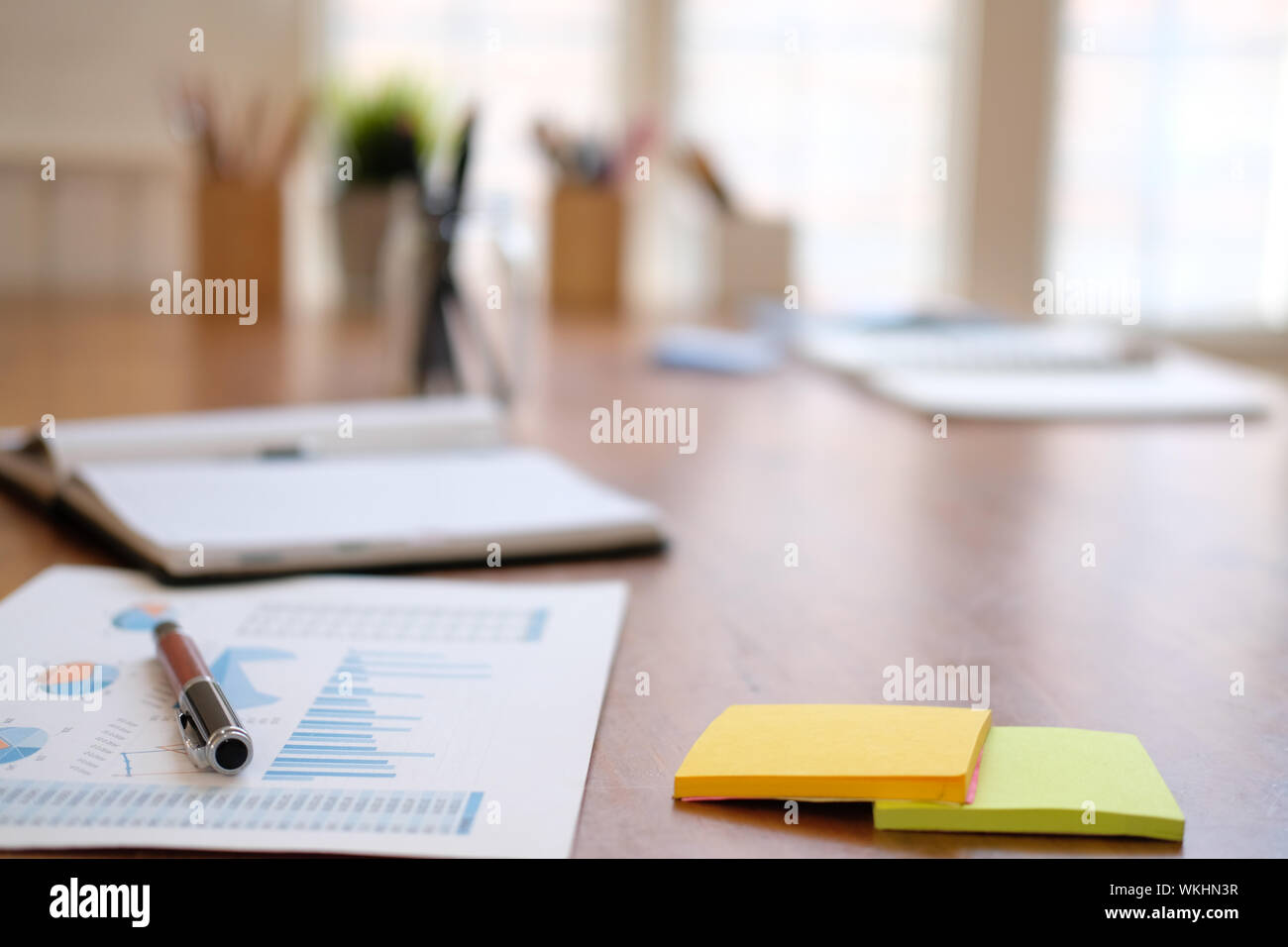 graph chart document on desk table at workplace office Stock Photo - Alamy