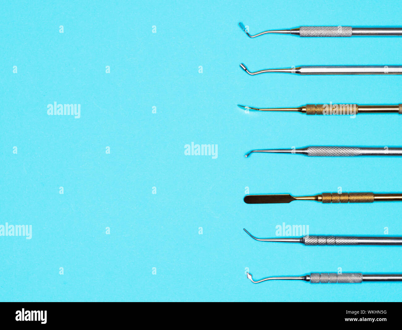 Dental instrument on blue background with copy space. Dental care ...