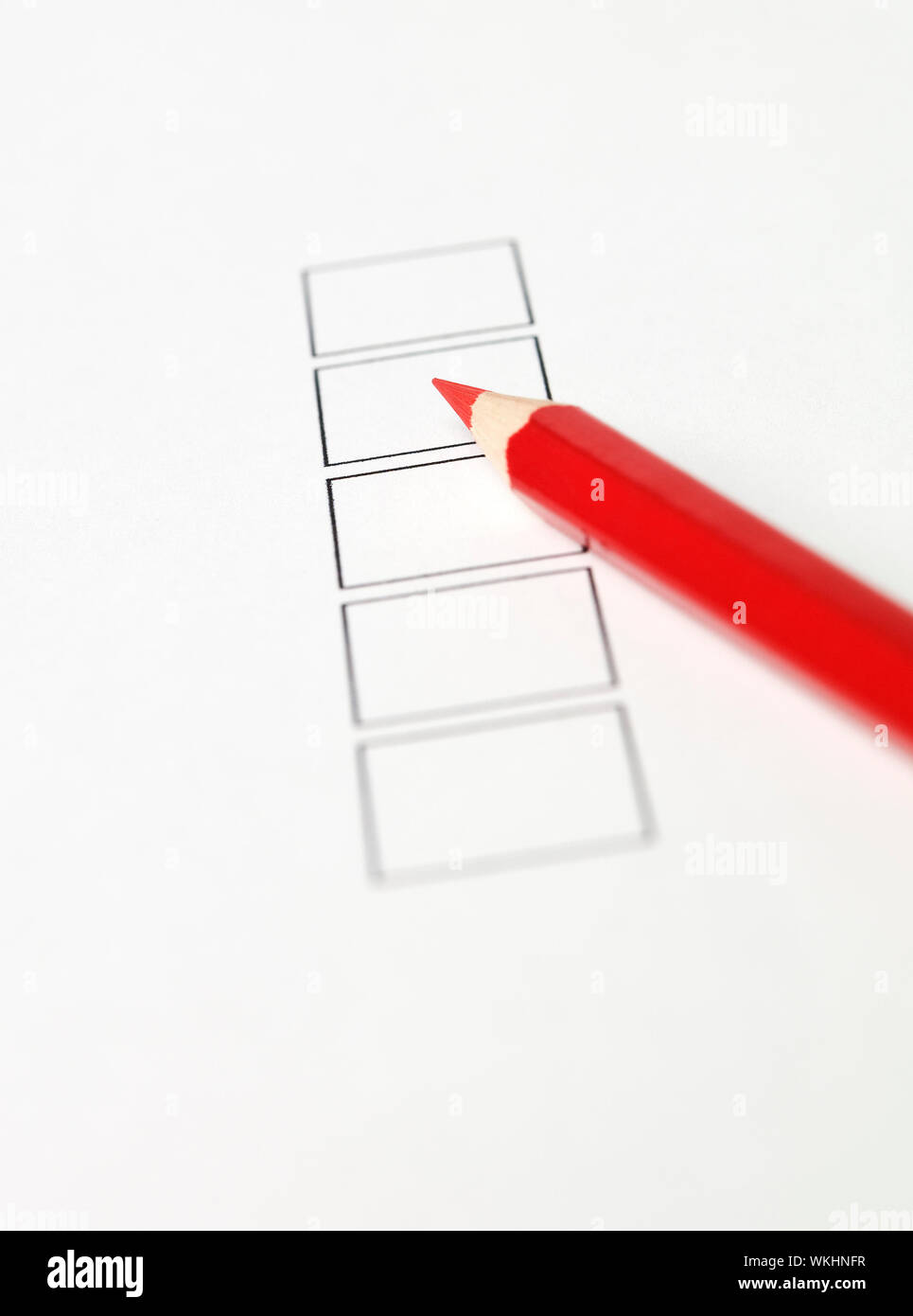 Red pencil and check boxes Stock Photo - Alamy