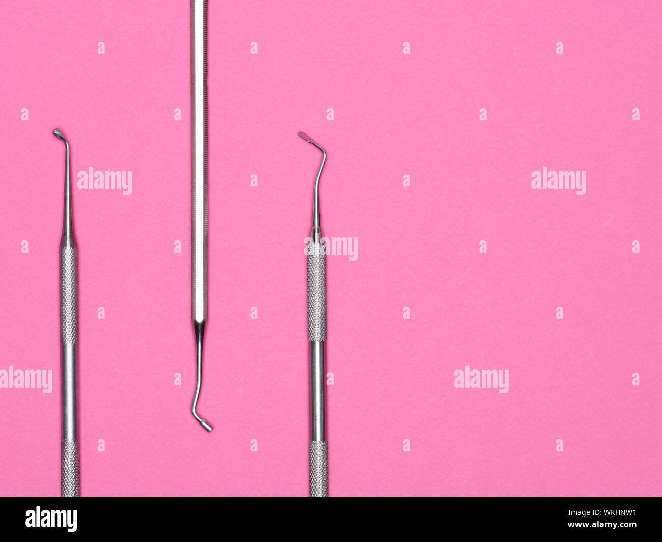 Dental tools on pink background with copy space. Dental care concept ...