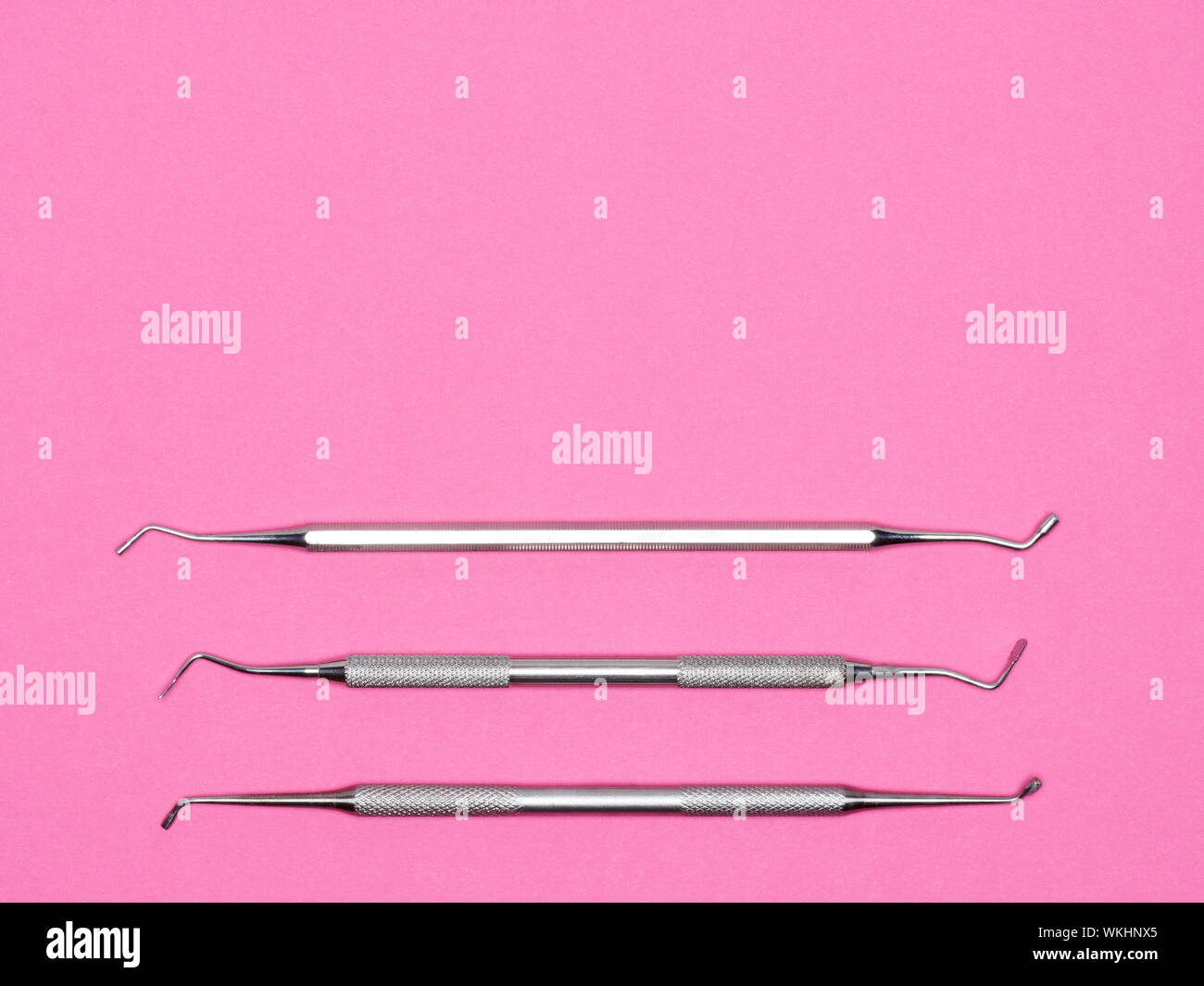 Dental tools on pink background with copy space. Dental care concept ...