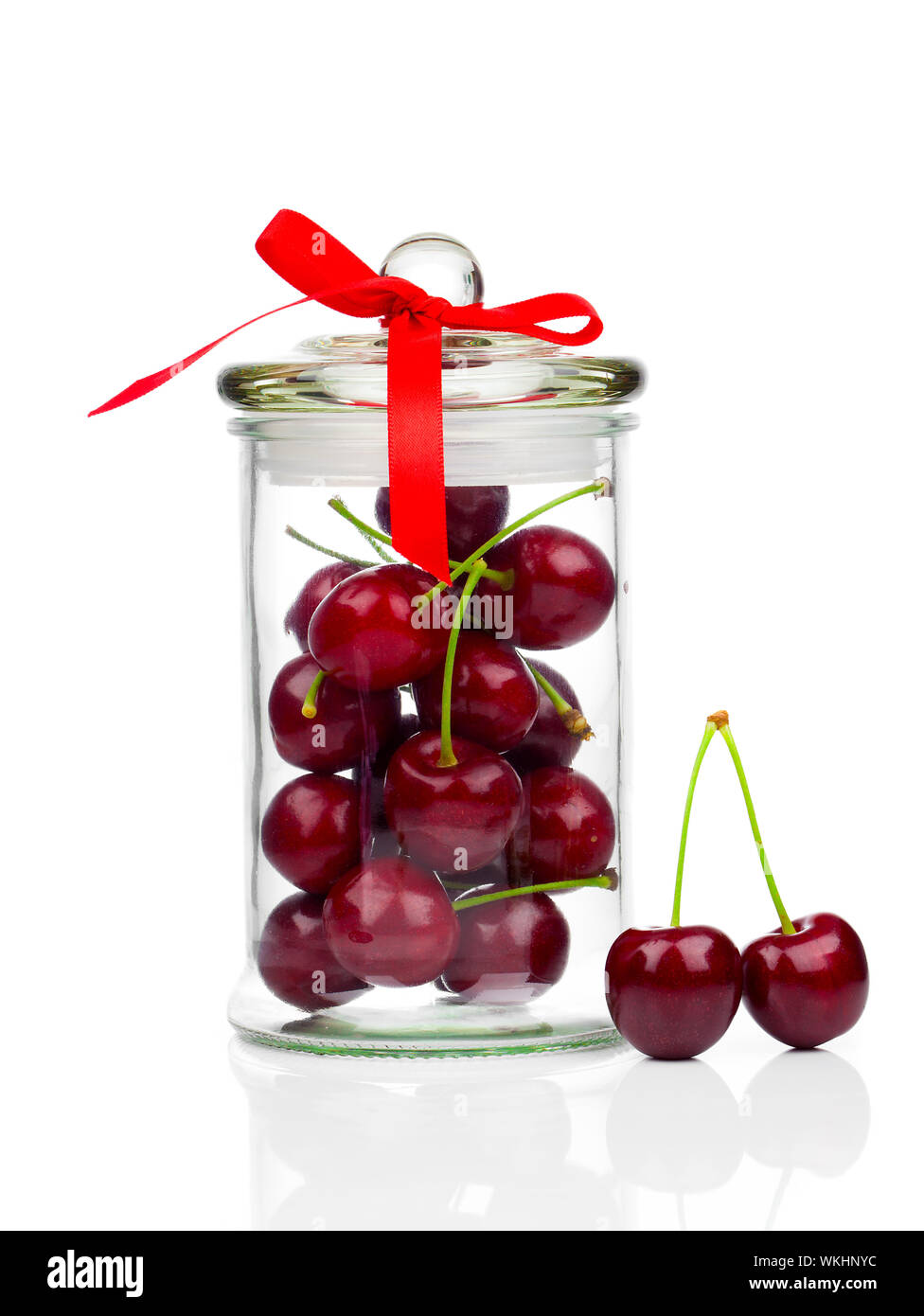 fresh Sweet cherry in glass jar, isolated on white Stock Photo - Alamy
