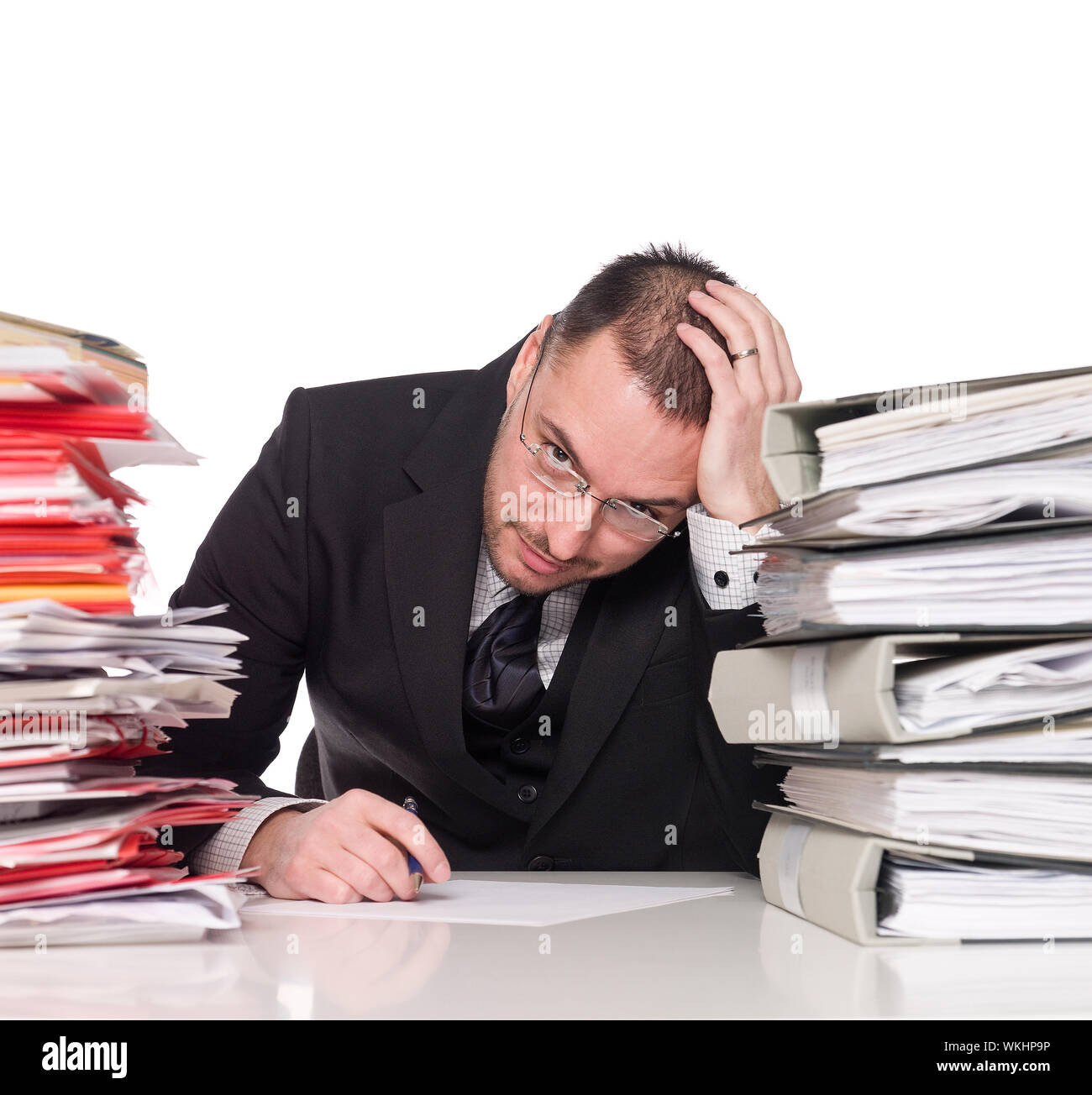 Hard working man in an office Stock Photo - Alamy
