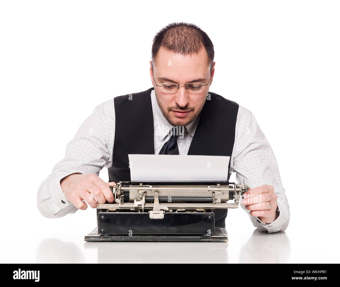 Man writing on a vintage typewriter Stock Photo - Alamy