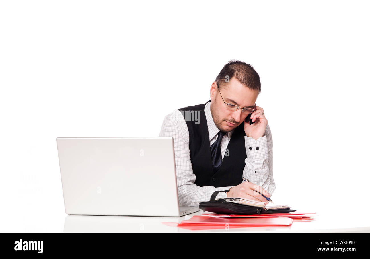 Man behind a desk organizing his day Stock Photo - Alamy