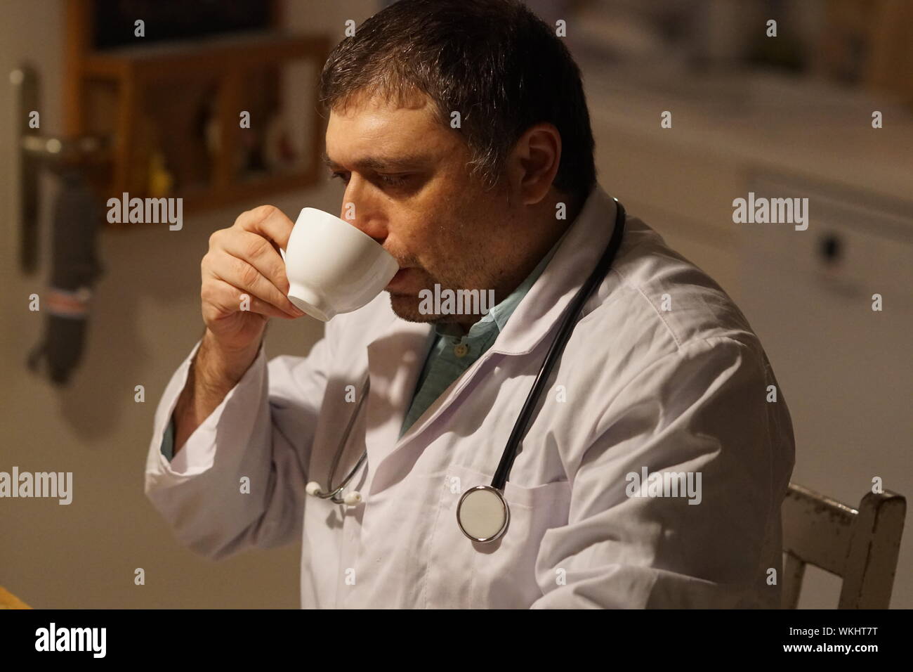 Doctor sitting side view hi-res stock photography and images - Alamy