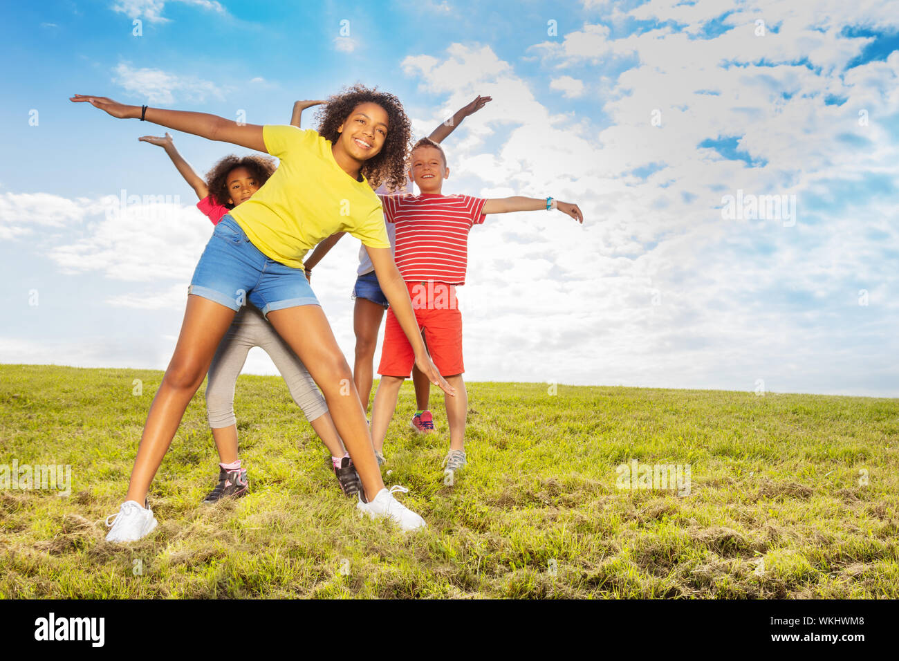 Group of kids boy with girls lean and stretch Stock Photo - Alamy