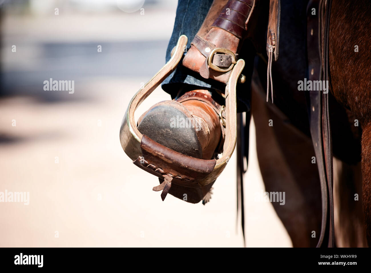 Cowboy leg and foot in stirrup on horse Stock Photo - Alamy