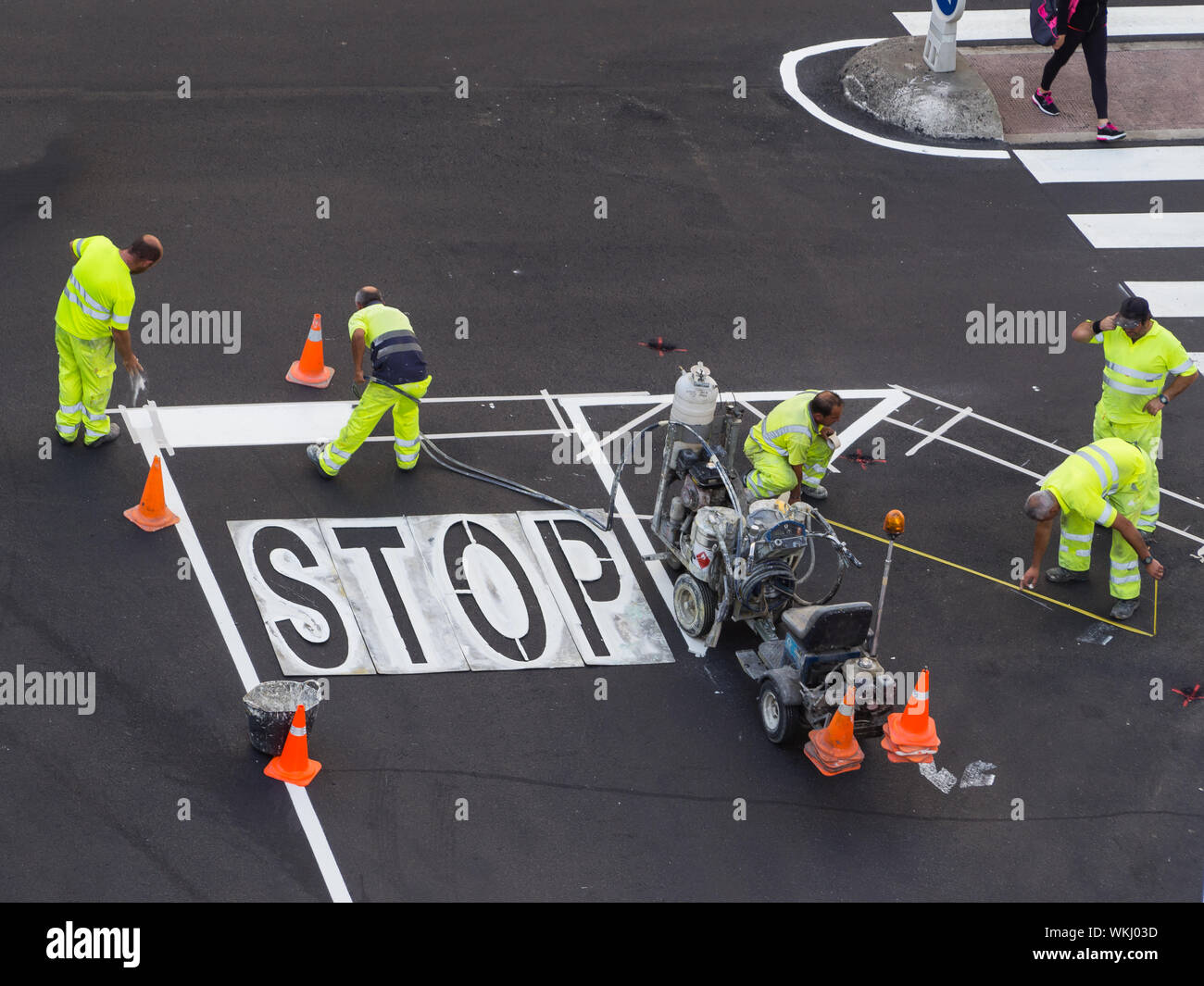 workers painting road signs, industry and teamwork Stock Photo - Alamy