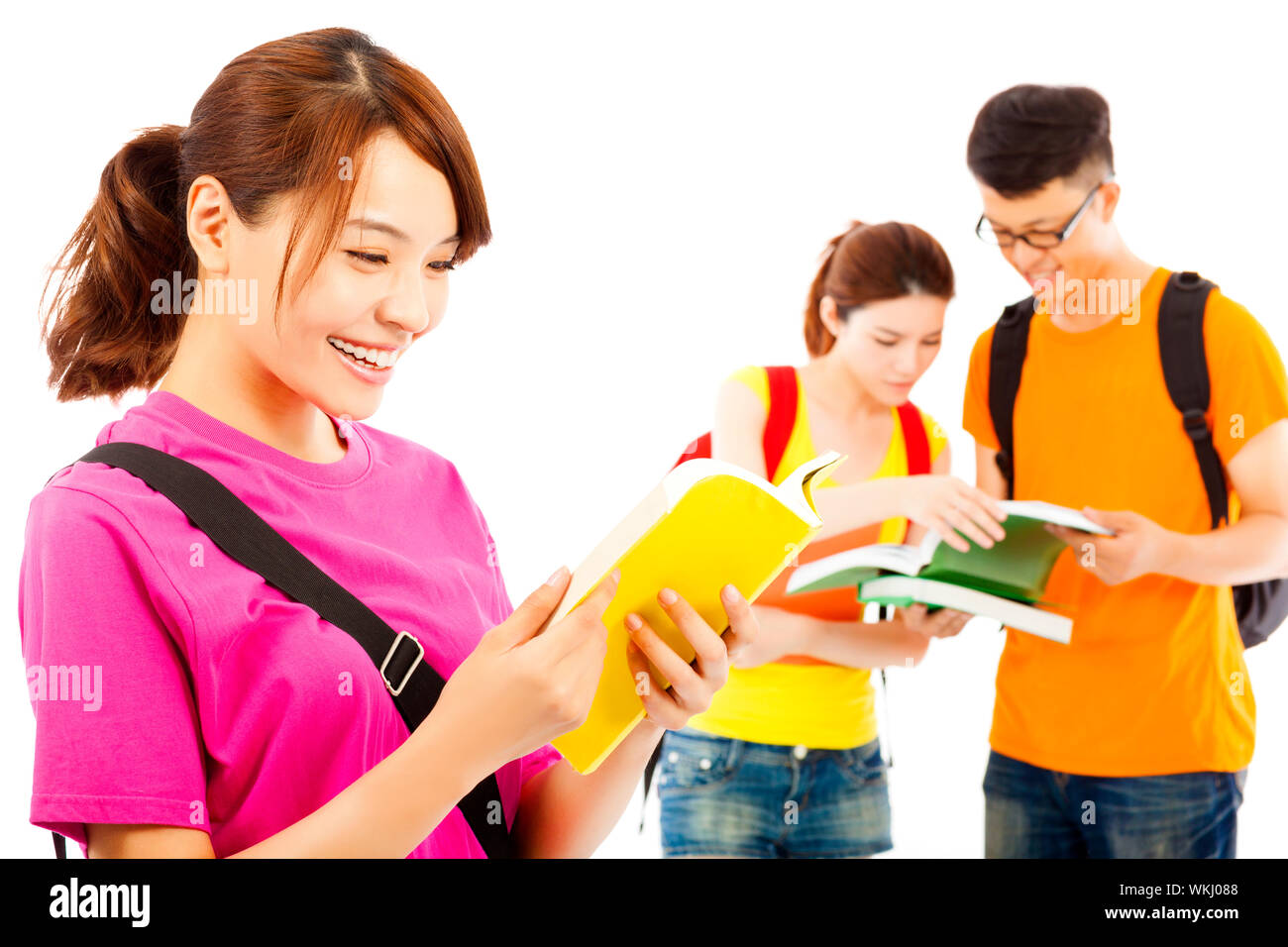 young student read a book with classmates Stock Photo - Alamy