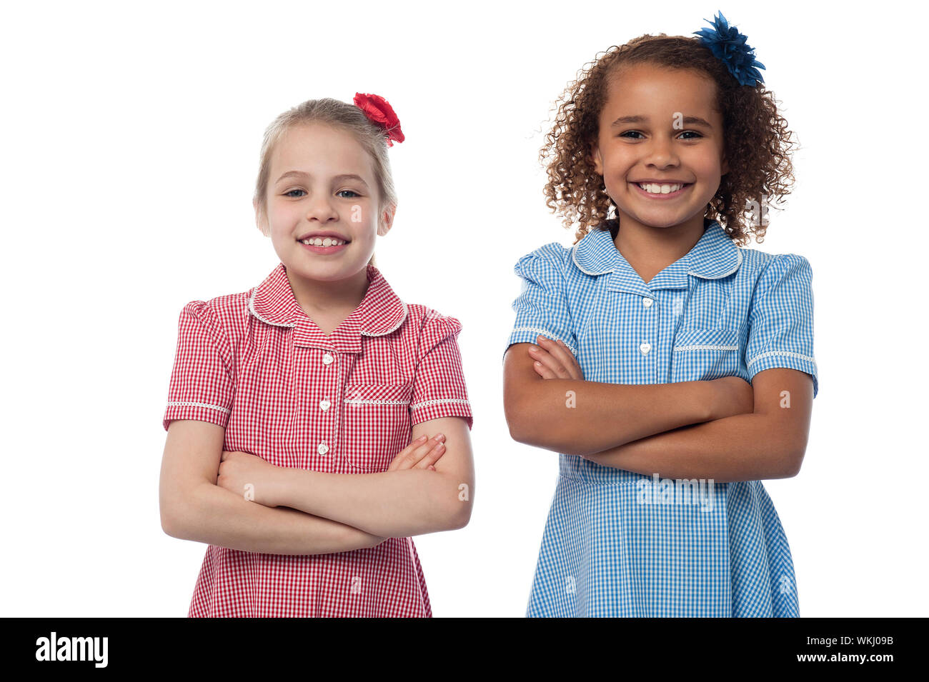 Confident school girls posing together, folded arms Stock Photo - Alamy