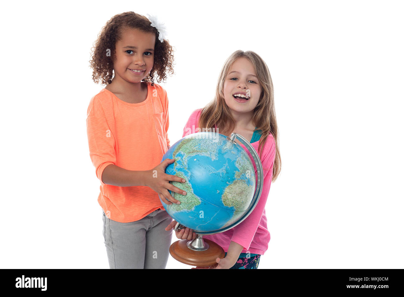 School girls locating countries on globe Stock Photo - Alamy