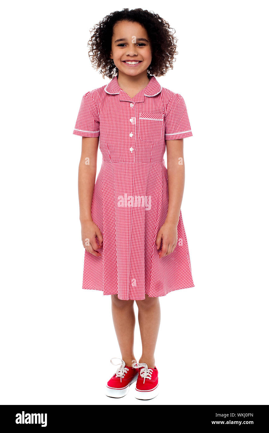 Smiling school girl in pink uniform Stock Photo - Alamy