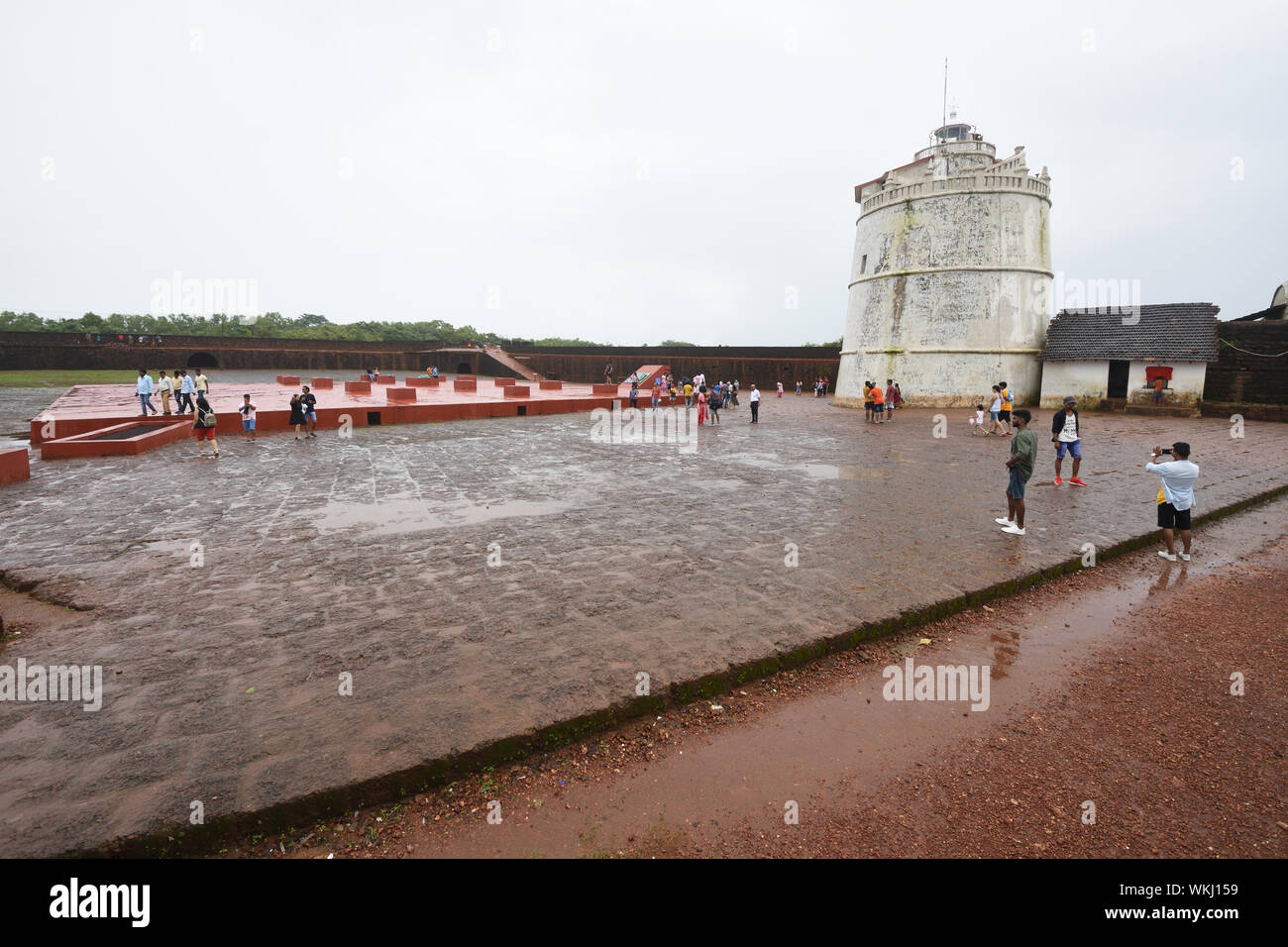 Tourists are walking at the Upper Aguada Fort. Bardez, North Goa, India ...