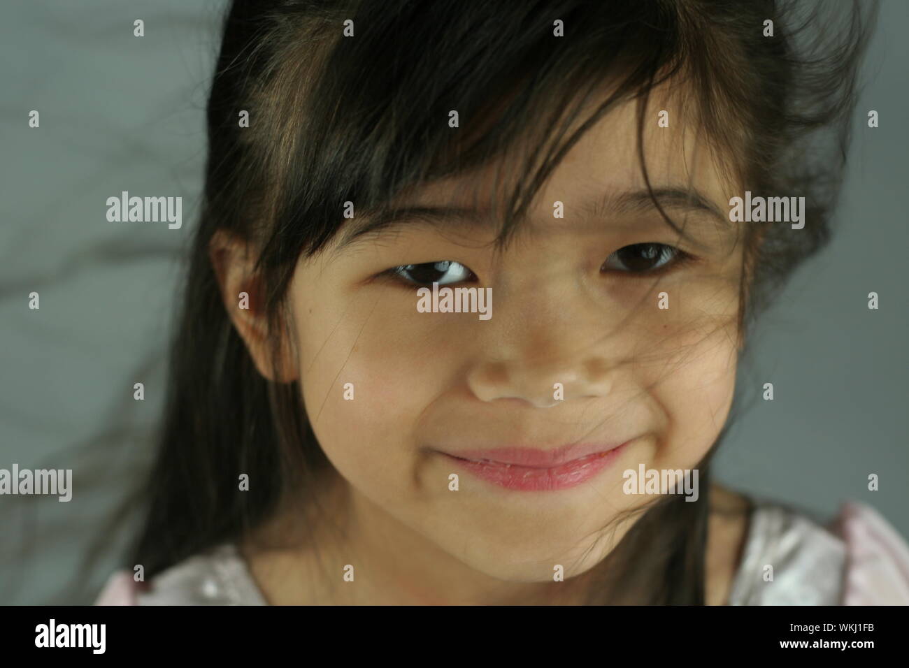 Beautiful child smiling into camera Stock Photo - Alamy