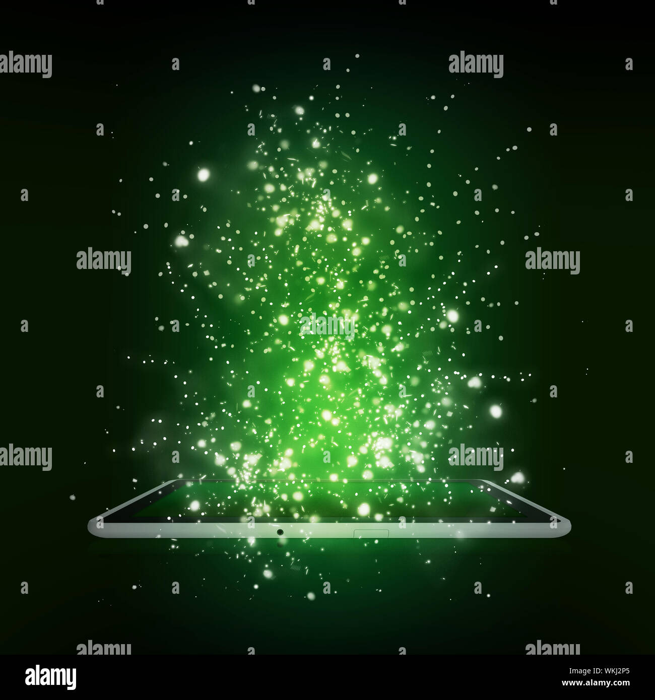 Tablet pc with magic light and falling stars. Dark background Stock ...