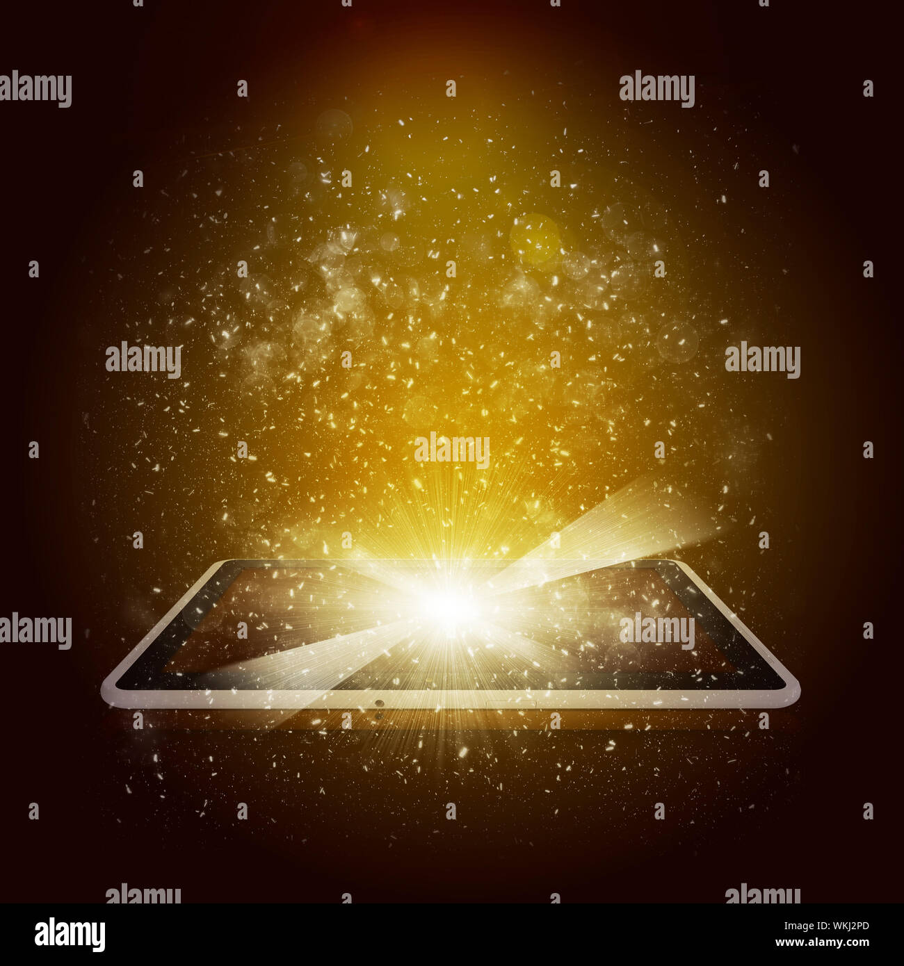 Tablet pc with magic light and falling stars. Dark background Stock ...