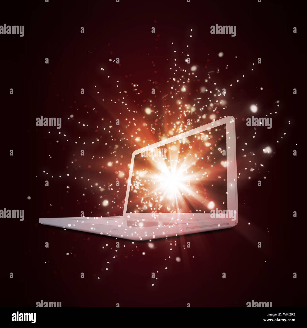 Open laptop with magic light and falling stars. Dark background Stock ...