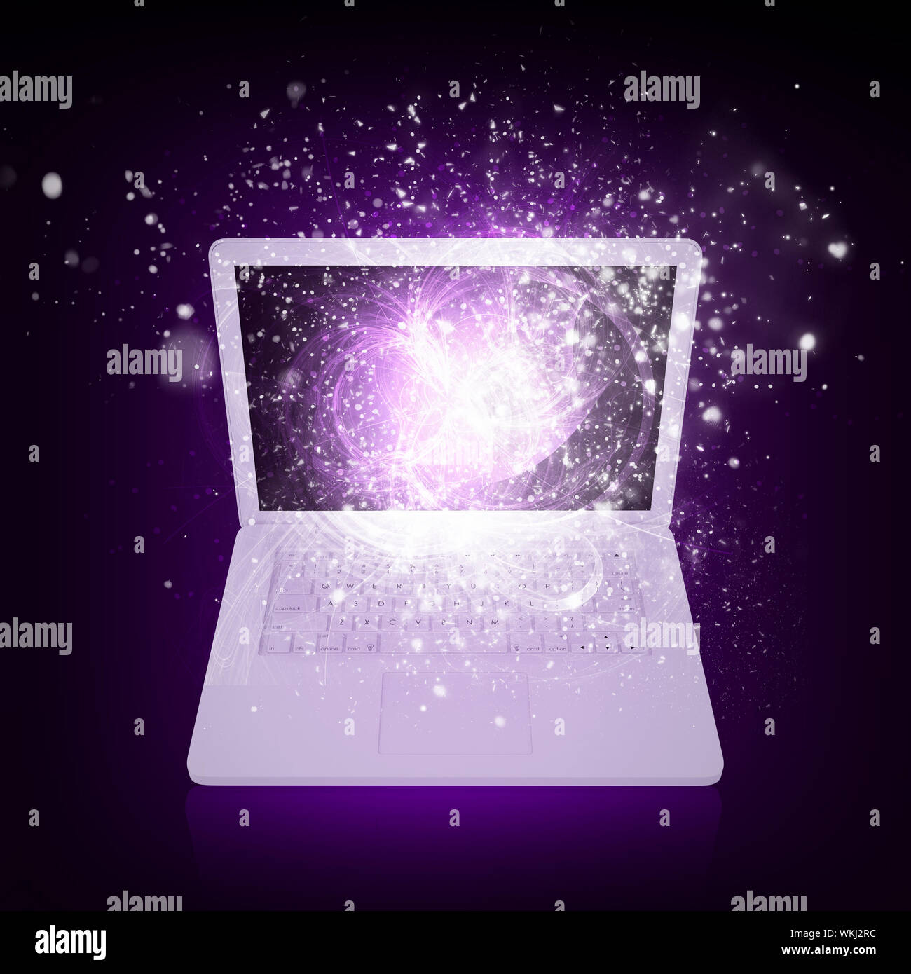 Open laptop with magic light and falling stars. Dark background Stock ...
