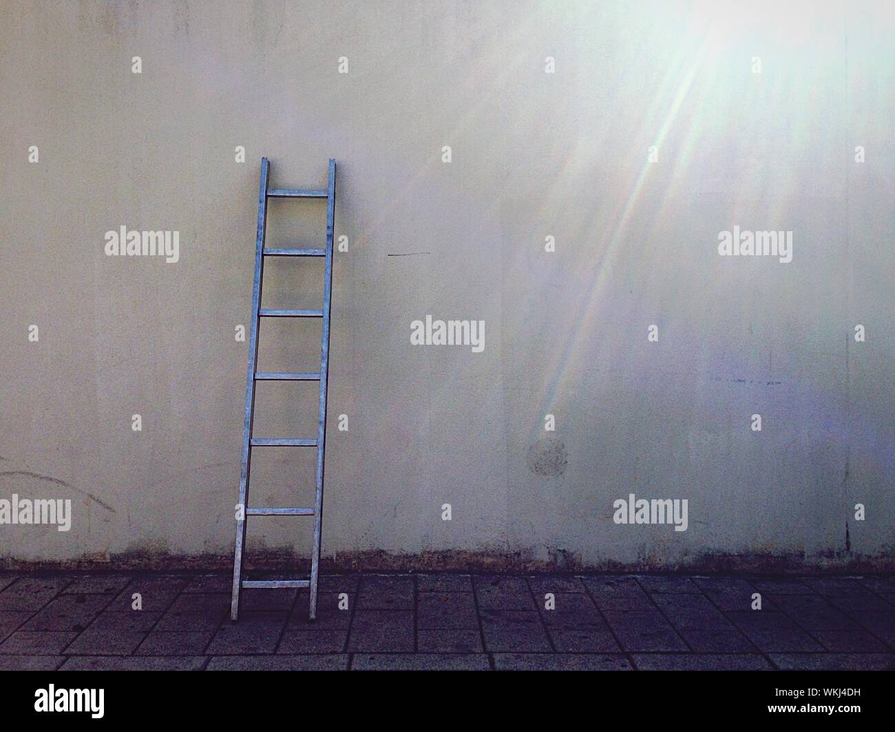 Ladder leaning against building hi-res stock photography and images - Alamy