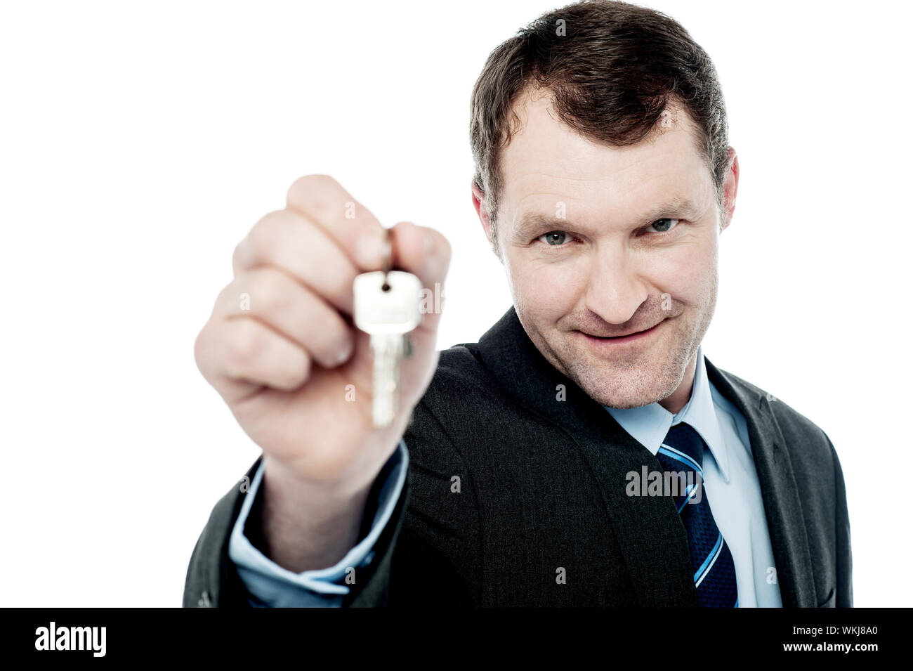 Businessman passing key hi-res stock photography and images - Alamy