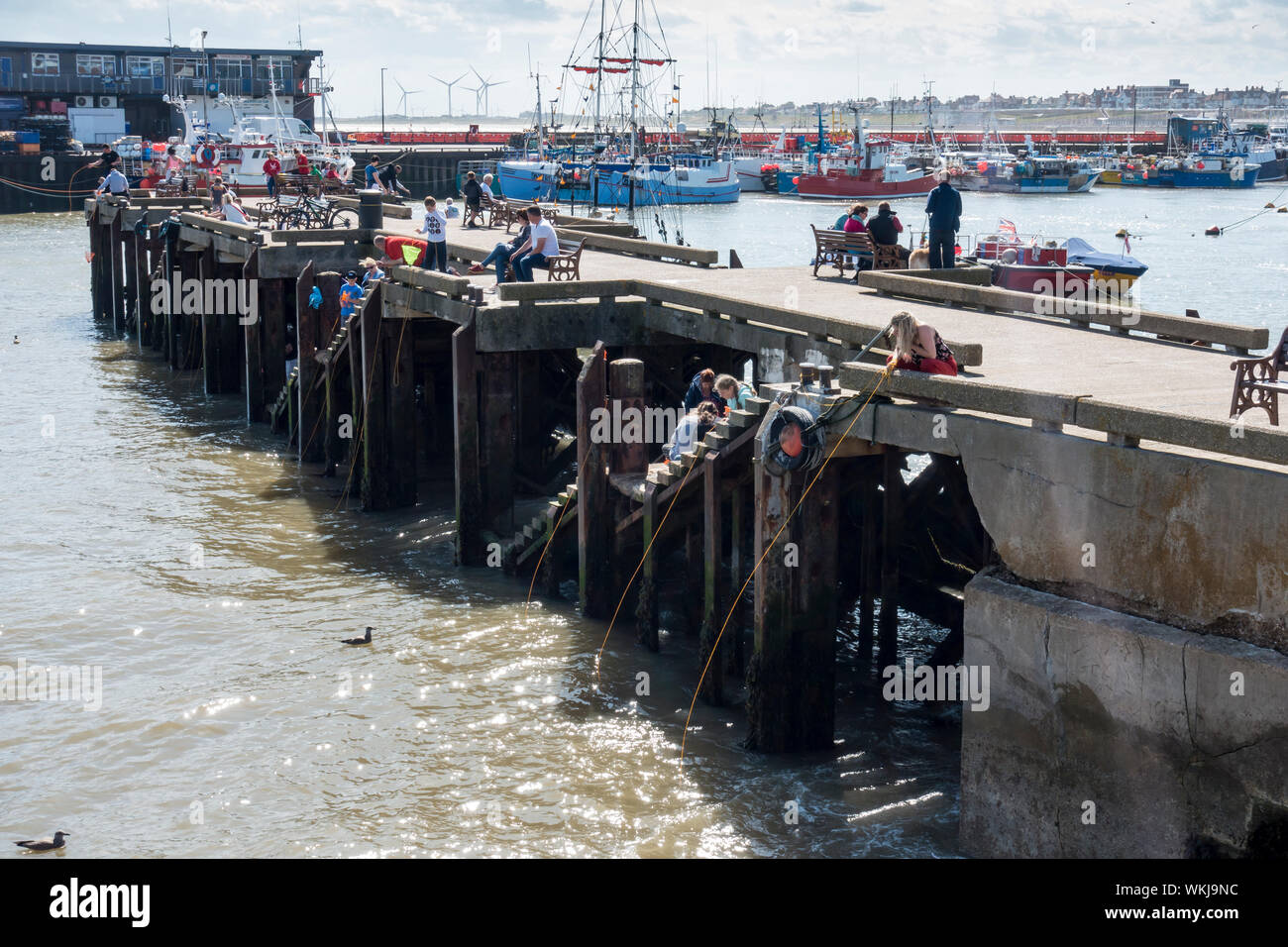 Children fishing from pier bridlington harbour east yorkshire 2019 hi ...
