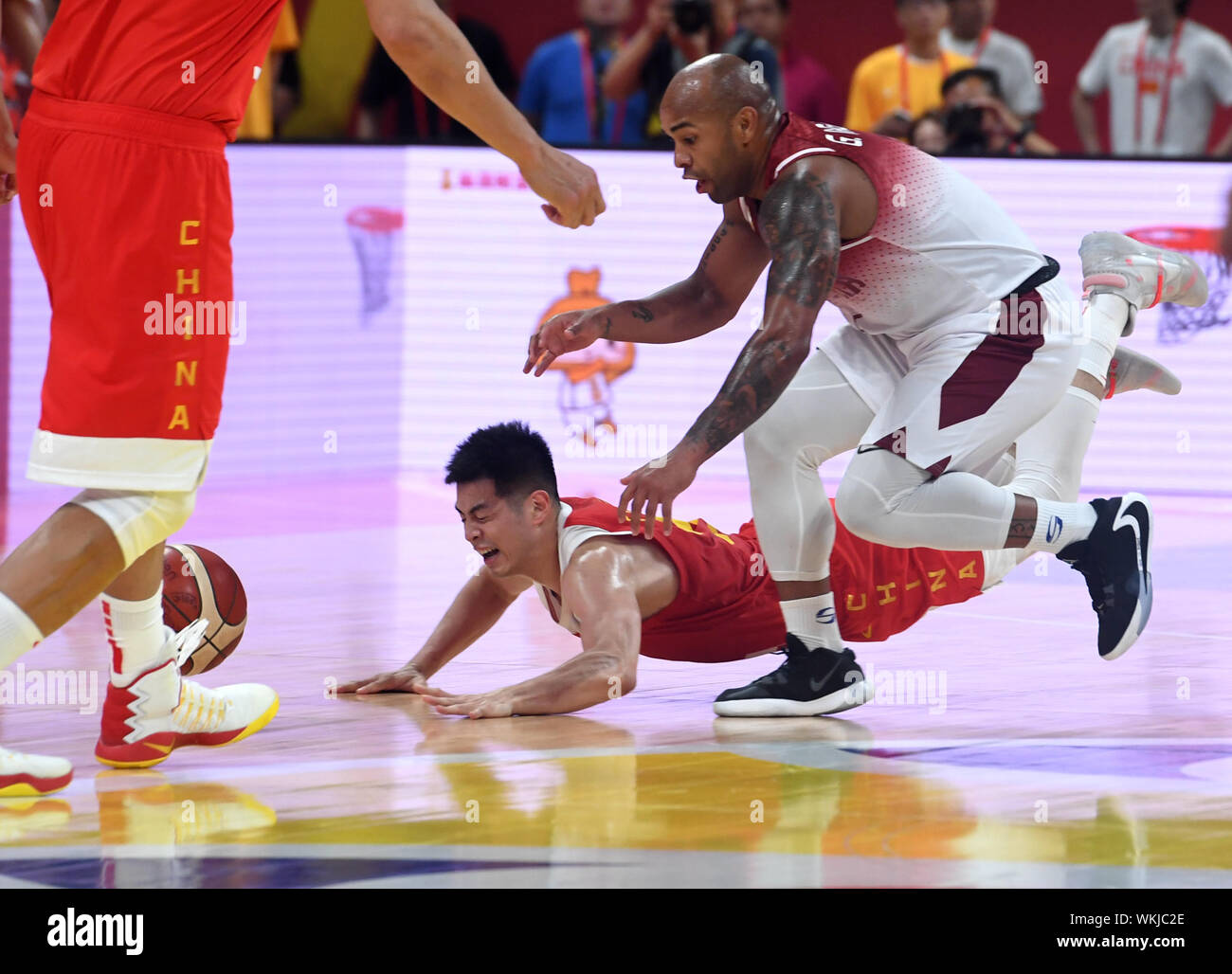 Beijing, China. 4th Sep, 2019. Fang Shuo (bottom) of China vies for the ...