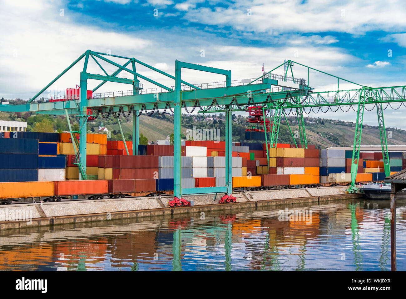 Shipyard with stacked cargo containers and cranes Stock Photo - Alamy