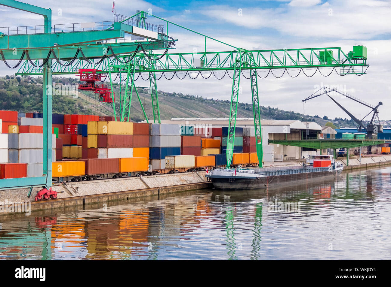 Shipyard with stacked cargo containers and cranes Stock Photo - Alamy