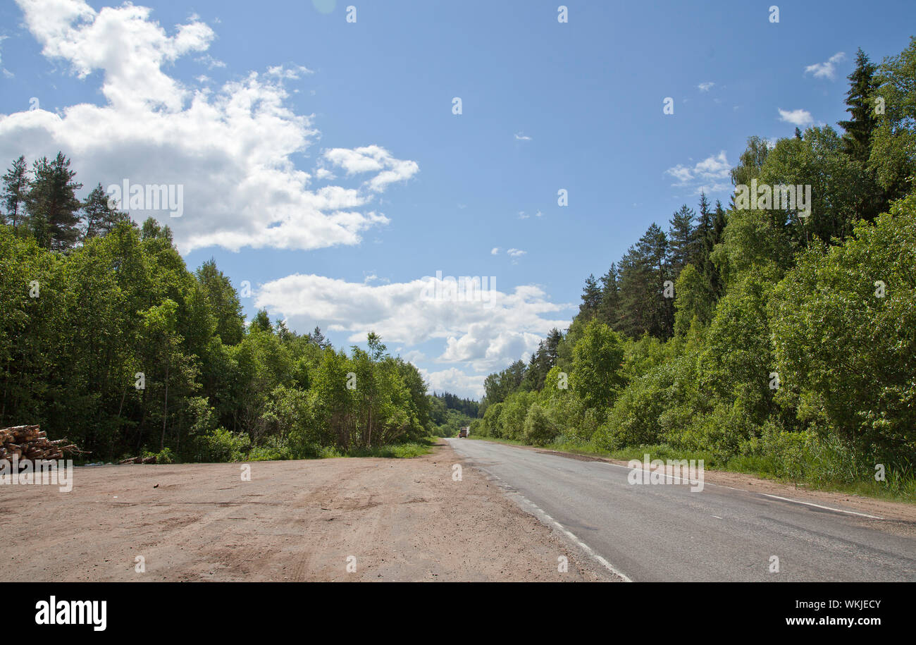 Summer lanscape with country road, trees and clouds Stock Photo - Alamy