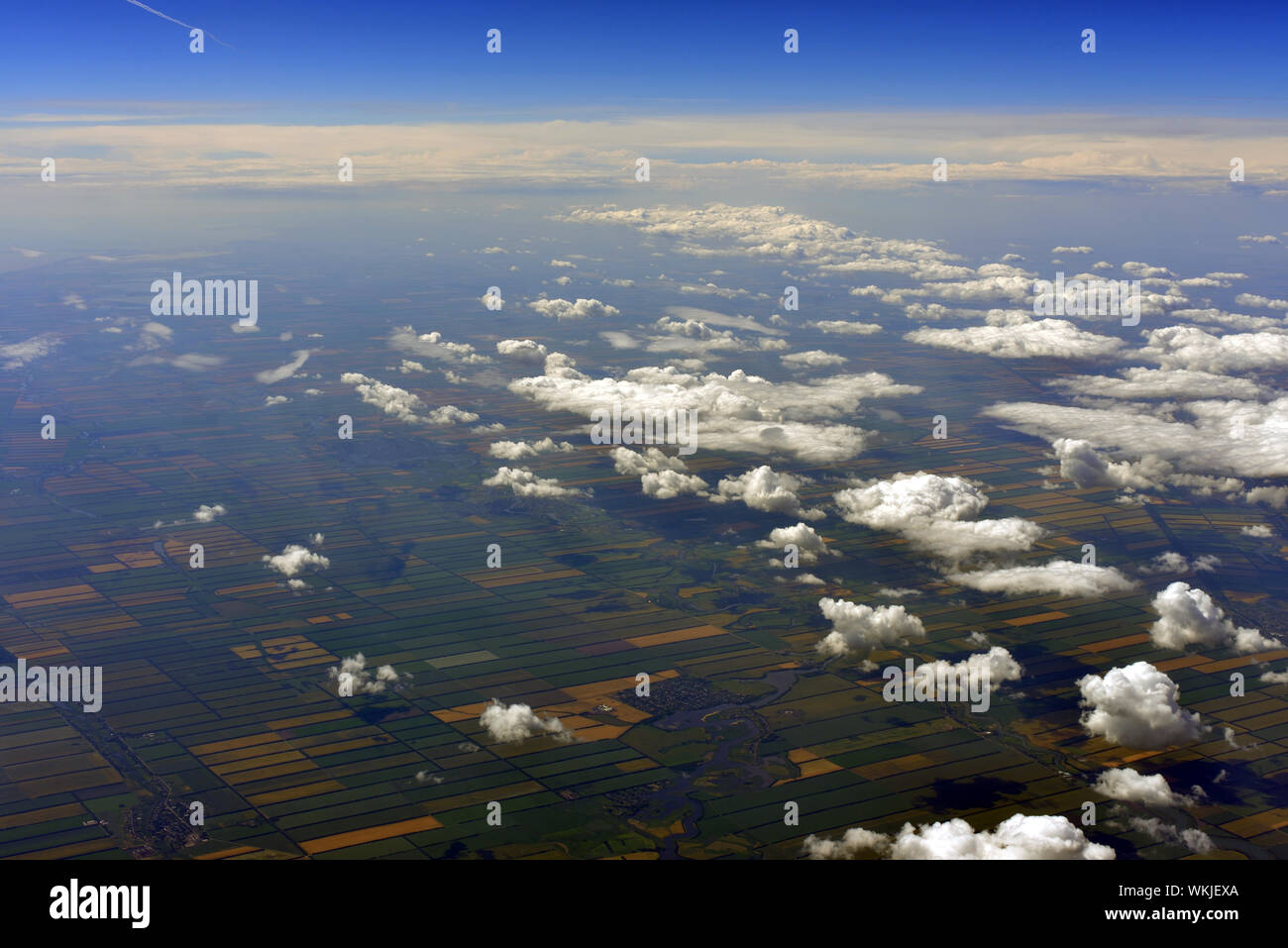 Earth's surface and clouds. Top view of aircraft Stock Photo - Alamy