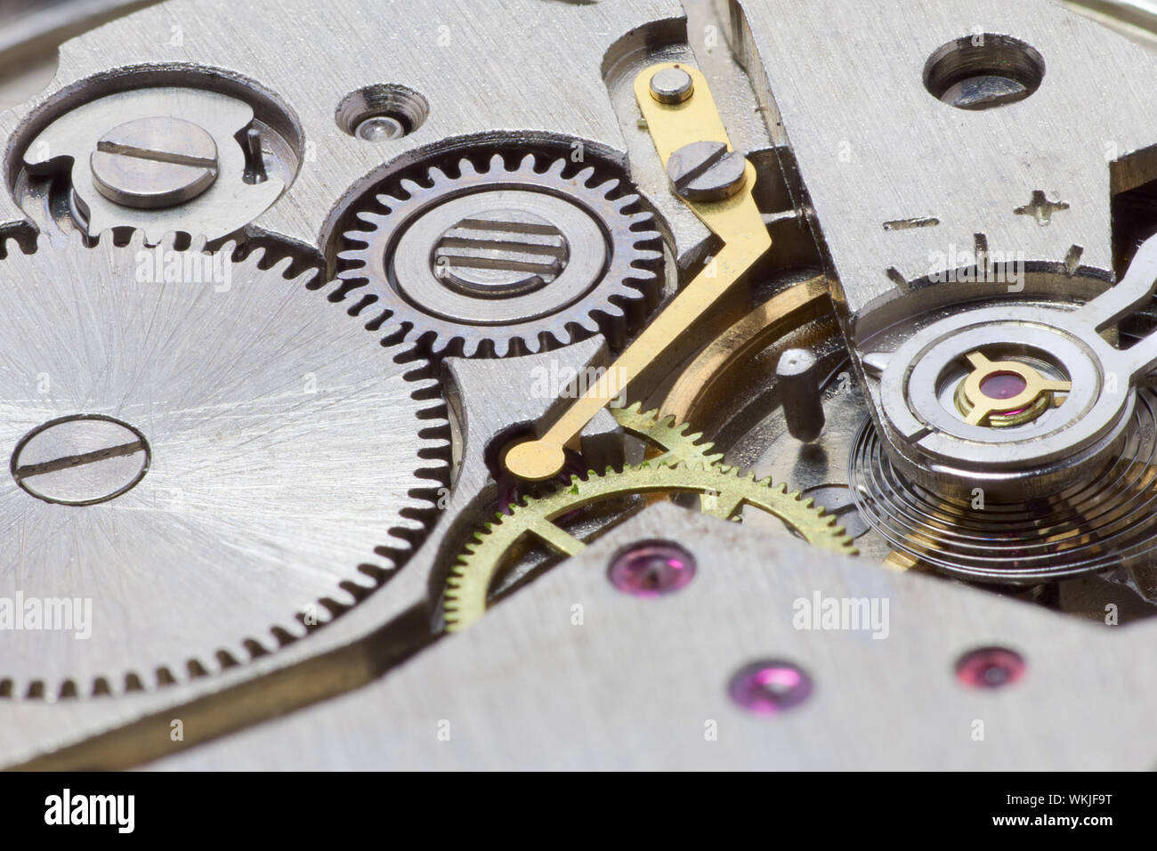 The ancient tiny metal clockwork close up Stock Photo - Alamy
