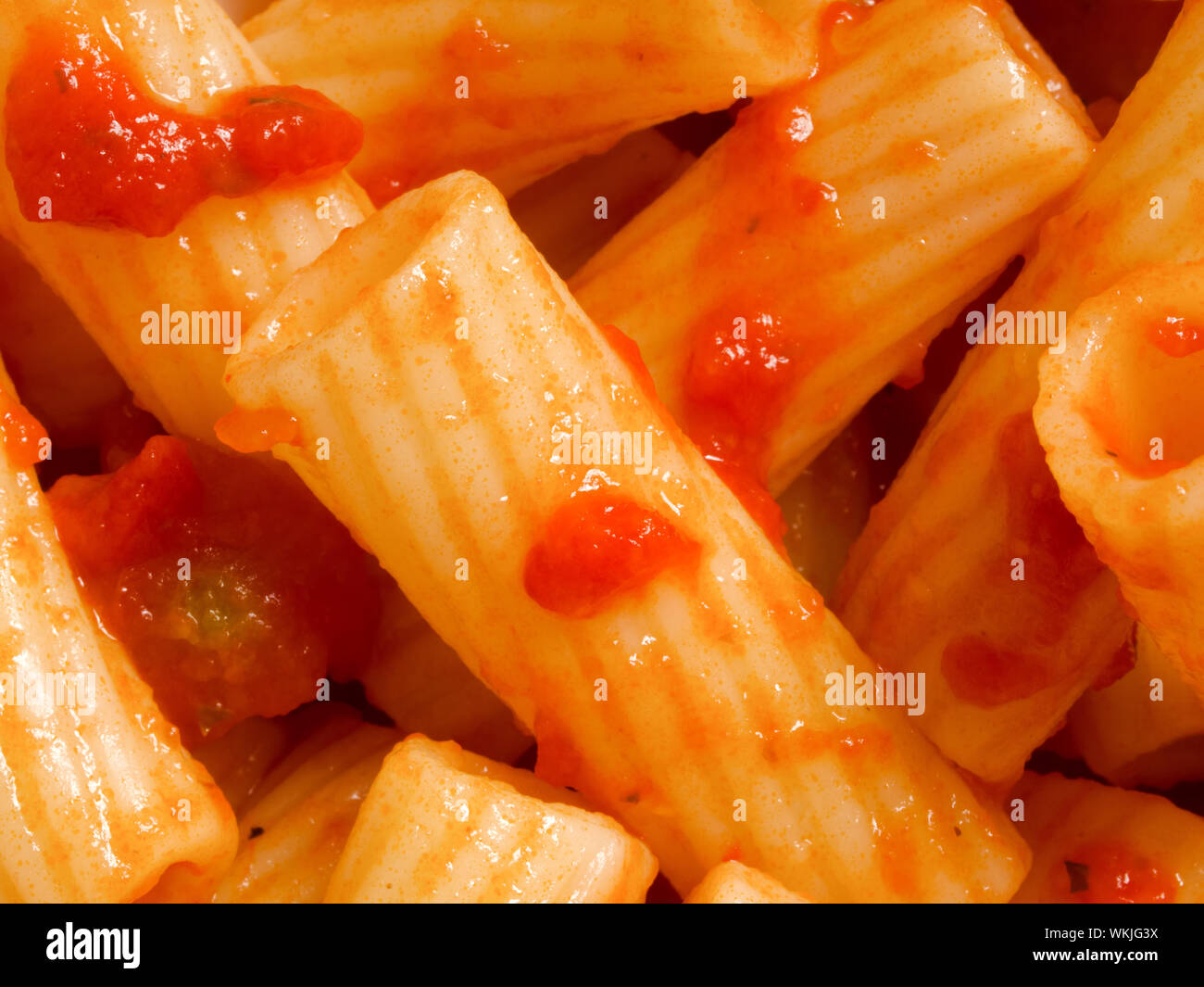 close up of maccheroni pasta in tomato sauce food background Stock ...