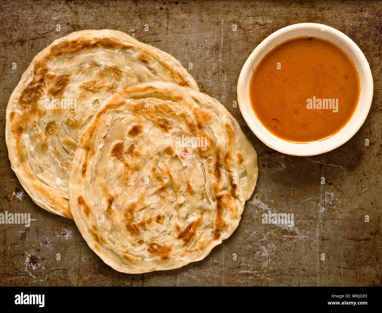 close up of rustic indian roti paratha fried pancake Stock Photo - Alamy