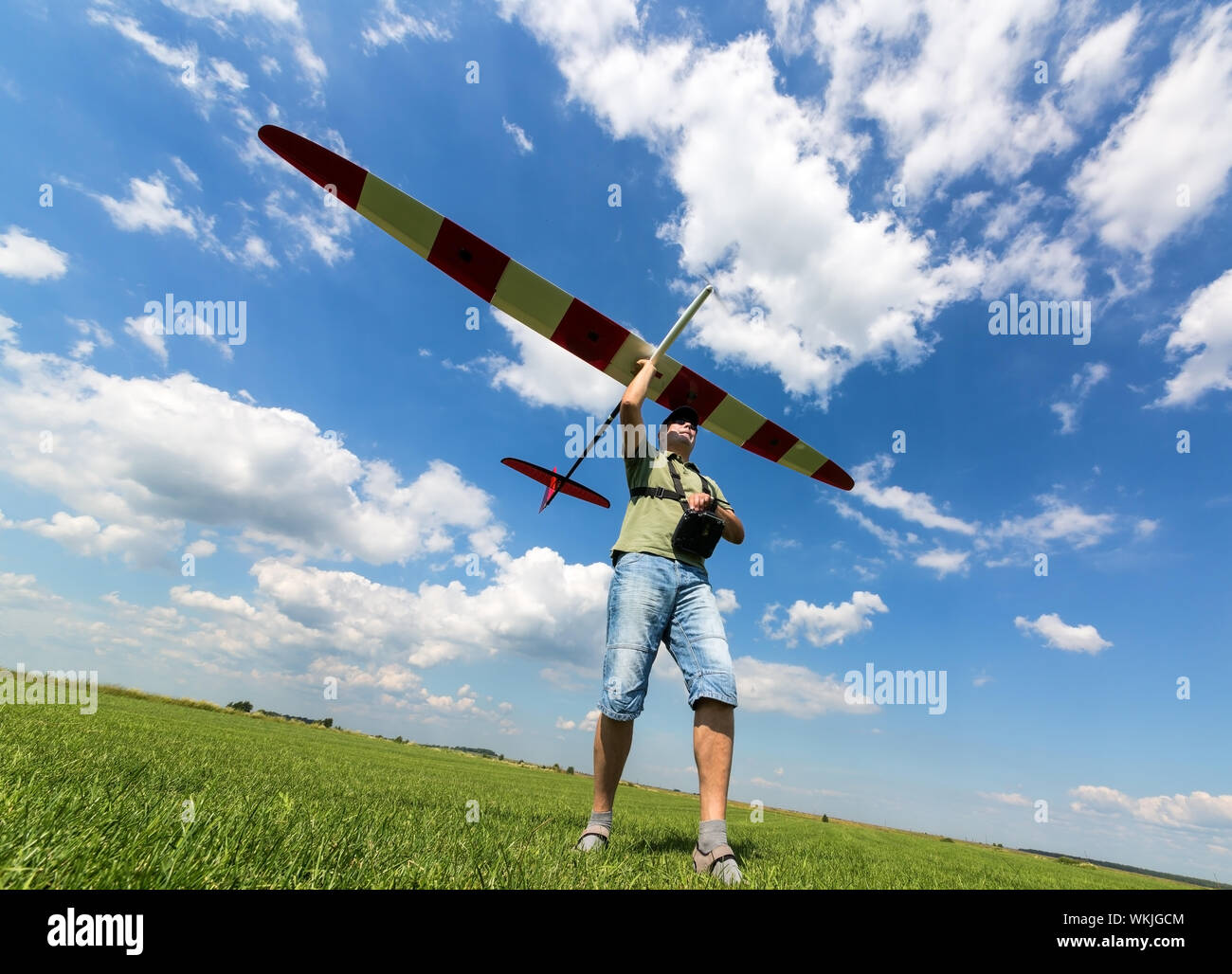 Man launches into the sky RC glider, wide-angle Stock Photo - Alamy