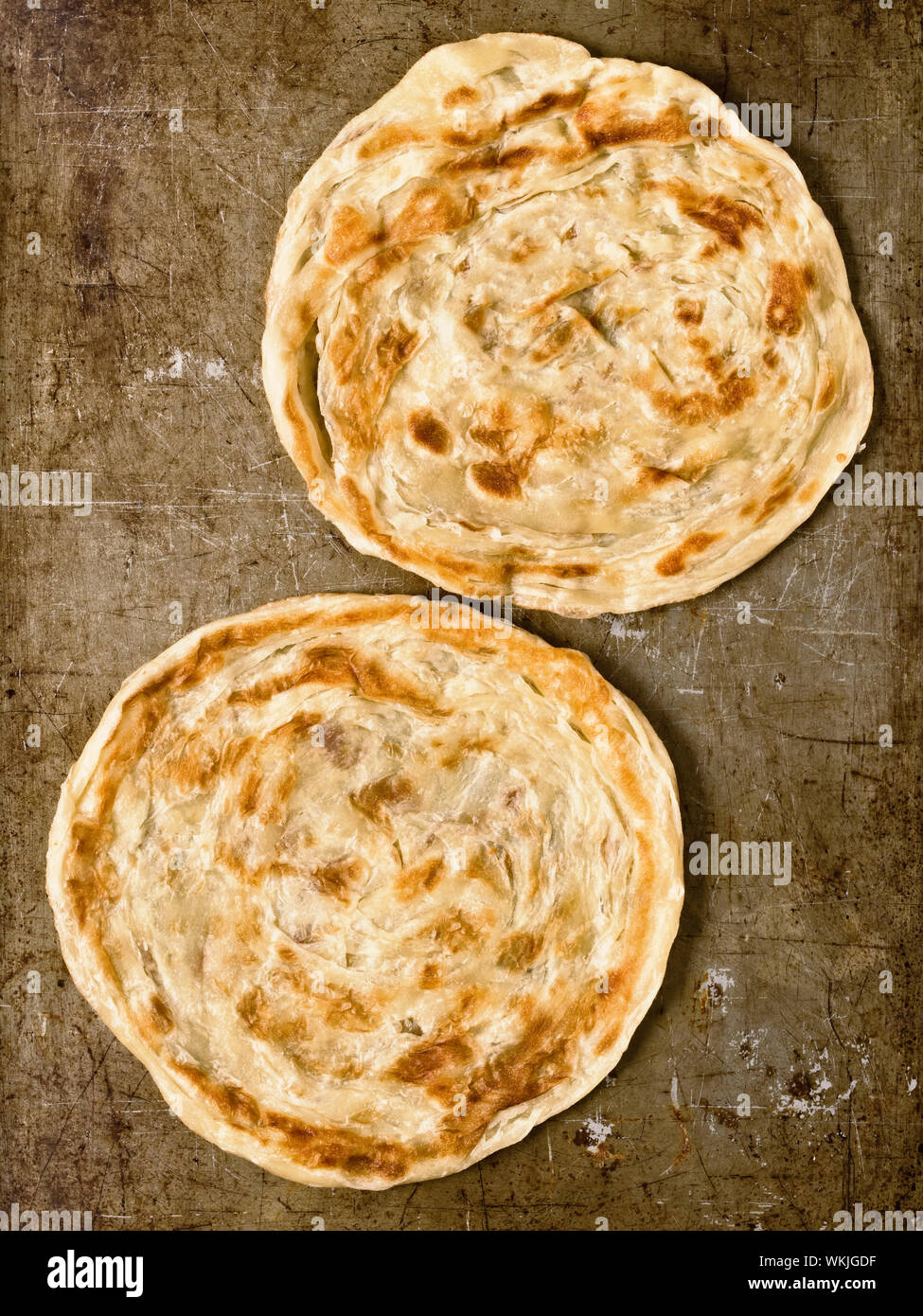 close up of rustic indian roti paratha fried pancake Stock Photo - Alamy
