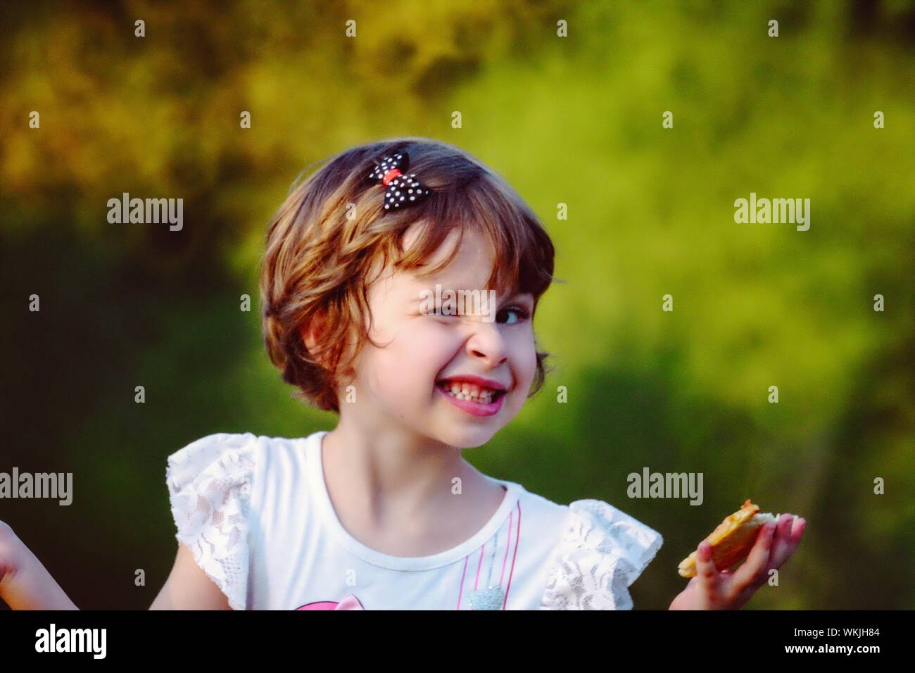 Portrait Of Girl Winking Stock Photo - Alamy