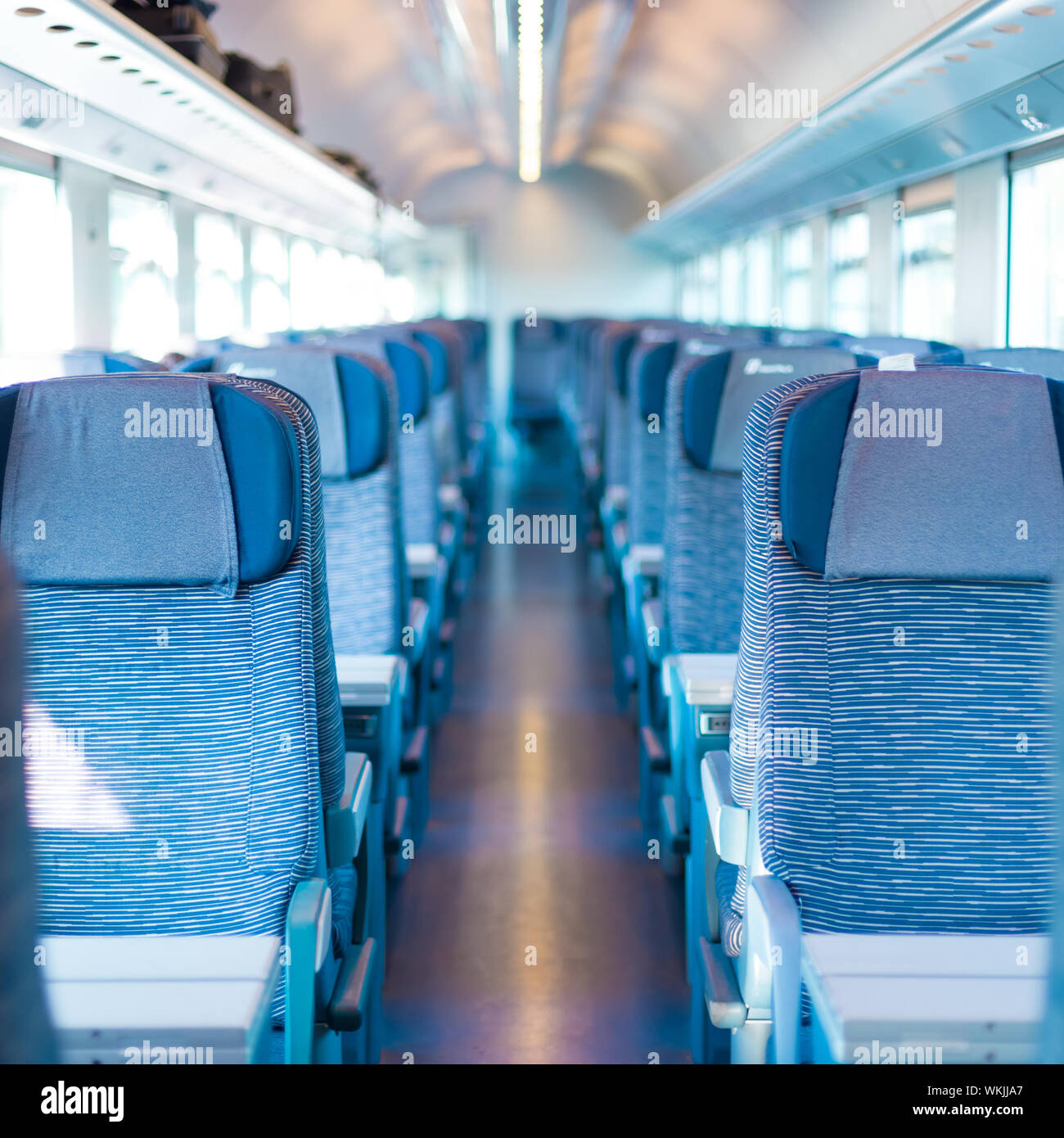 Modern european economy class fast train interior. Inside of high speed ...