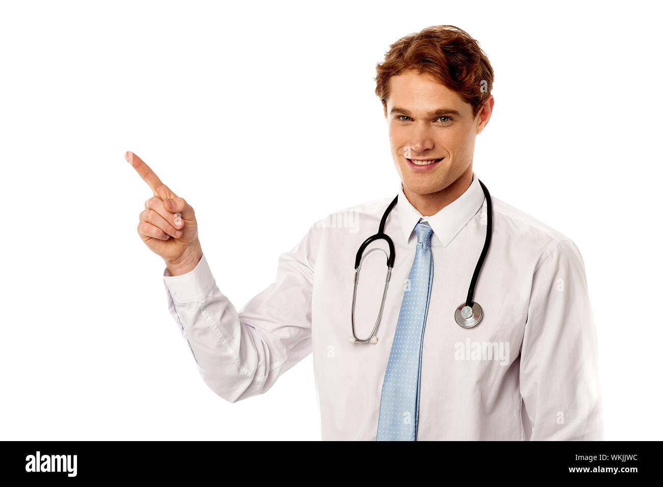 Smart young doctor pointing at something Stock Photo - Alamy