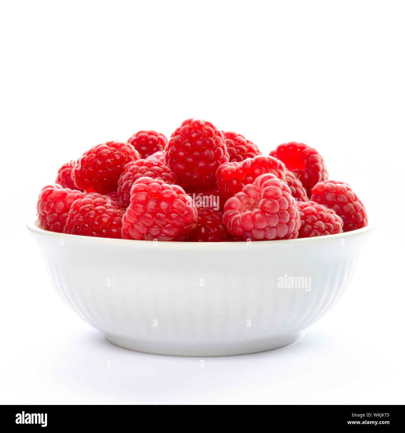 Big Pile of Fresh Raspberries in the White Bowl Isolated on the White ...