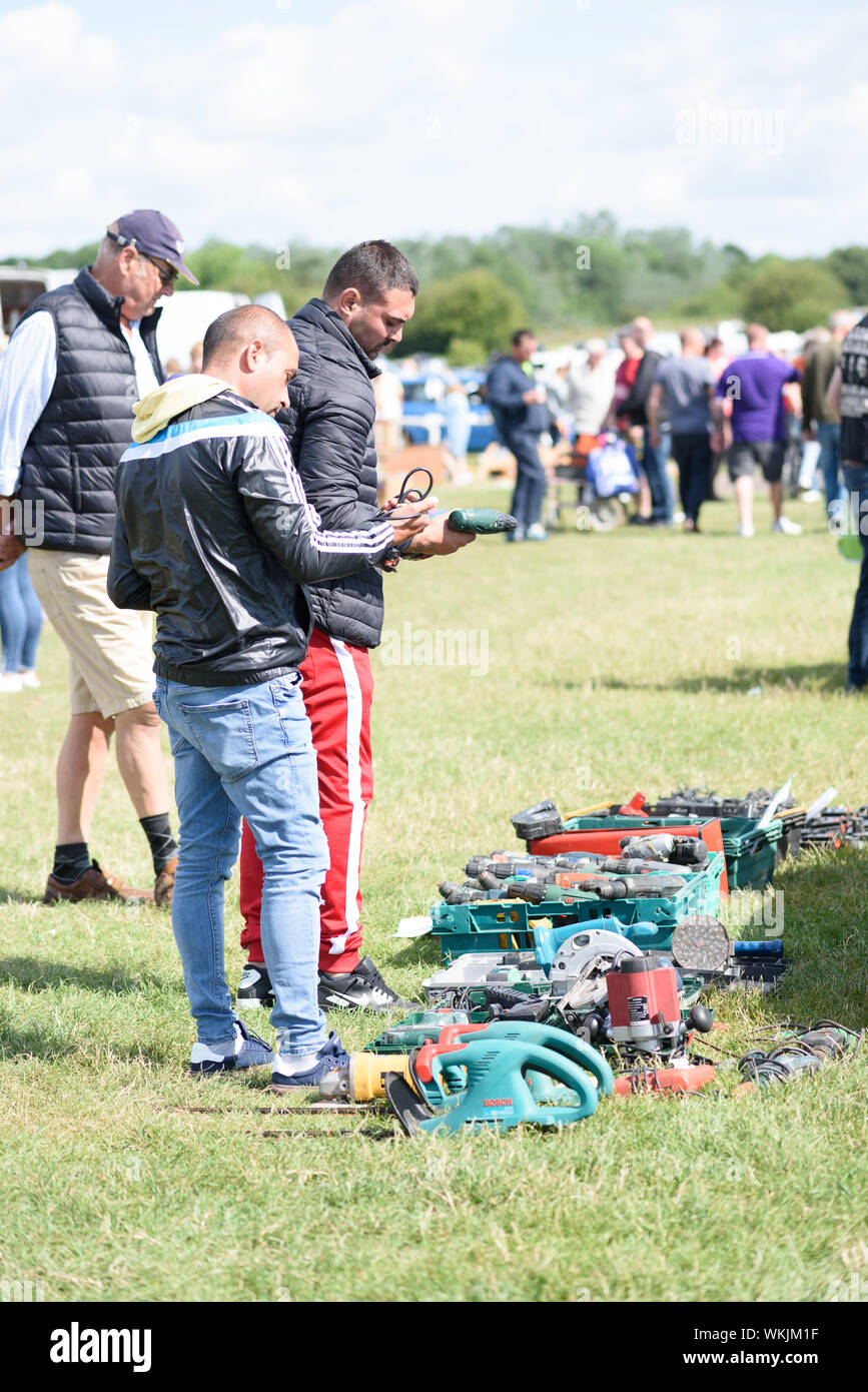 CHELMSFORD, ESSEX/ENGLAND - 1ST JUNE 2019 - Men visiting a car boot ...