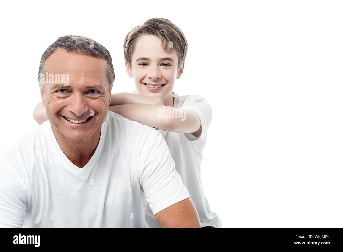 Smiling son holding hand on his father shoulder Stock Photo - Alamy