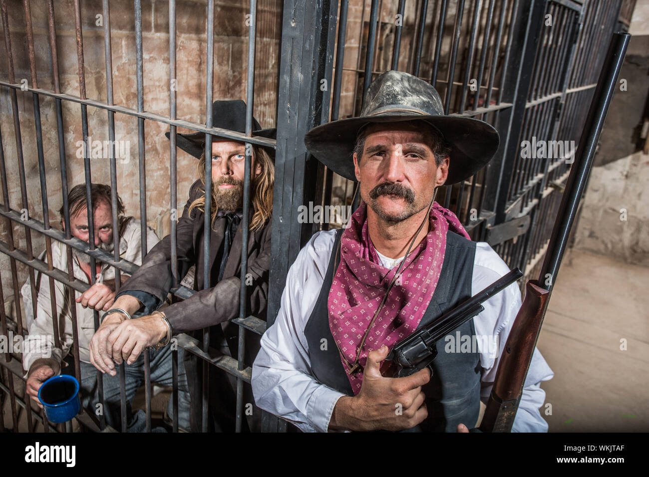 Sheriff Stands Stern in Front of a Jail Cell Stock Photo - Alamy