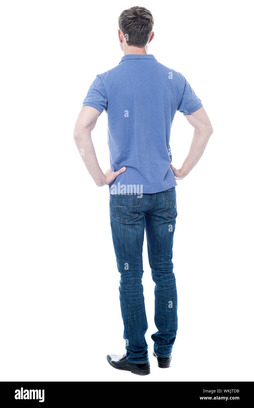 Rear view, full length shot of a young man looks ahead Stock Photo - Alamy