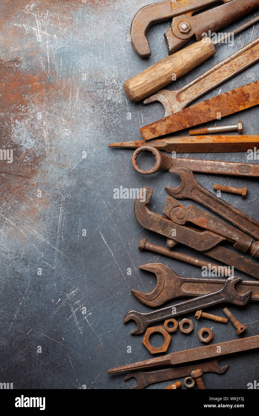Vintage old tools on stone backdrop. Top view with copy space. Flat lay ...