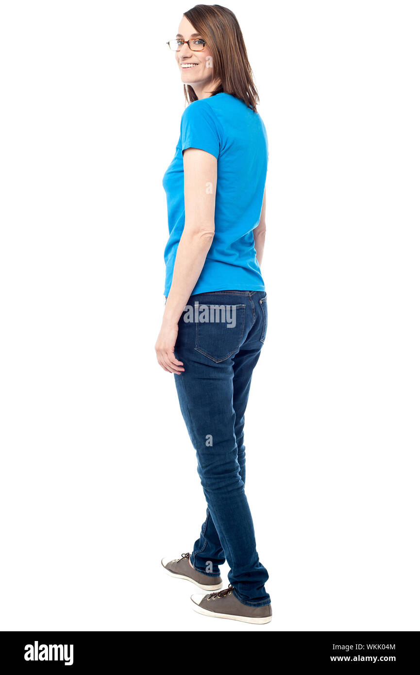 Full length image of casual woman turning back Stock Photo - Alamy