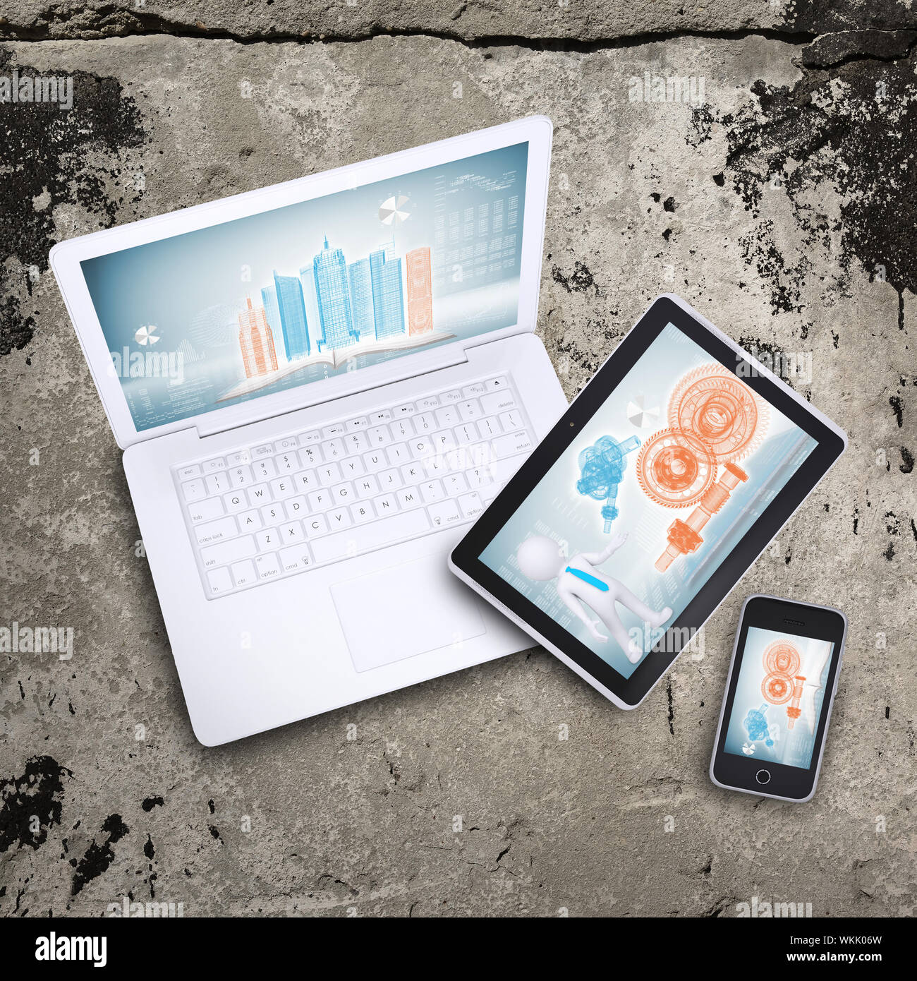 Laptop, tablet pc and smart phone on old concrete surface. Computer ...