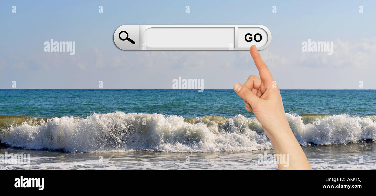 Human hand indicates the search bar in browser. Waves breaking on stony ...
