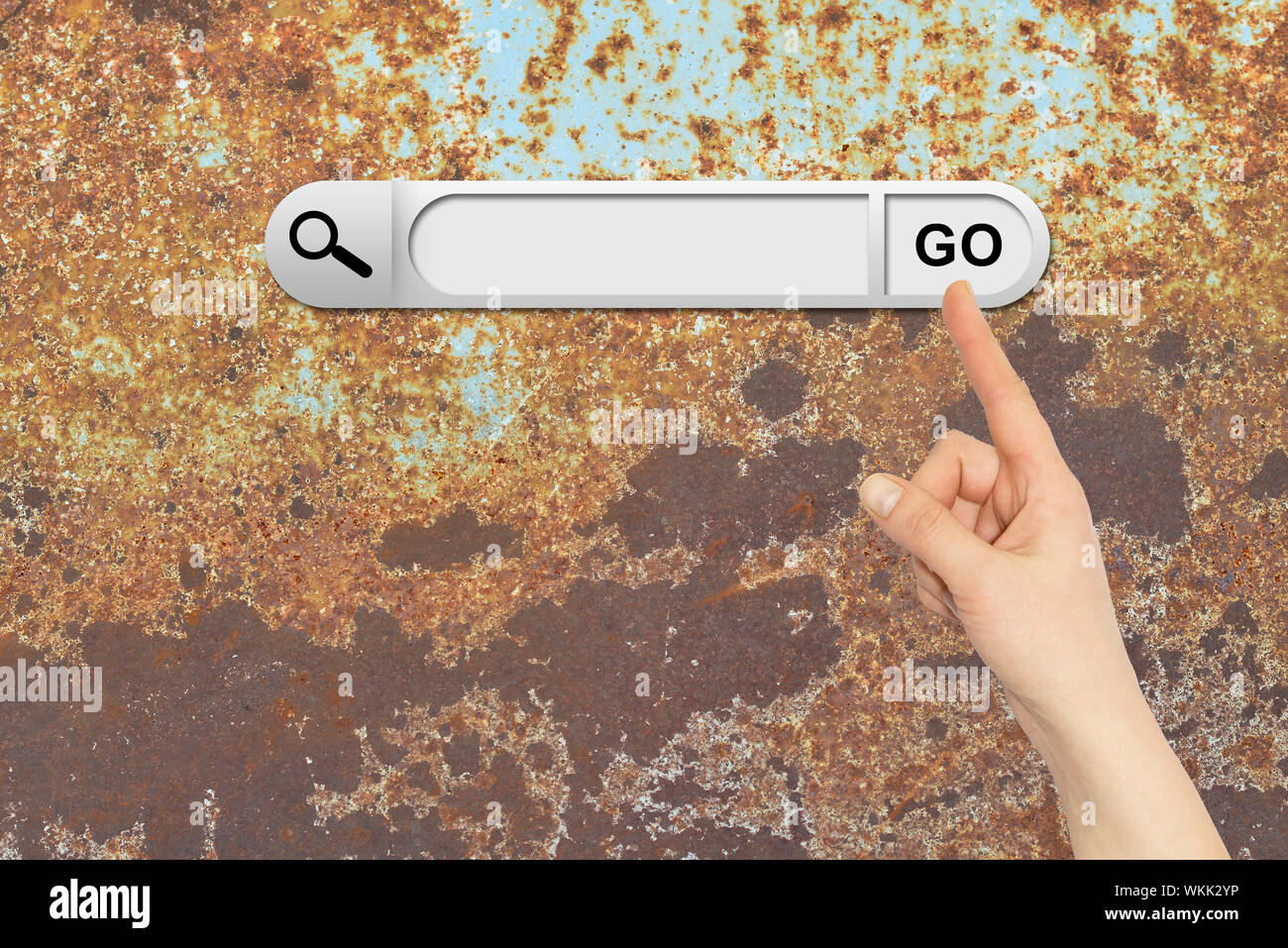 Human hand indicates the search bar in browser. Old rusty metal surface ...