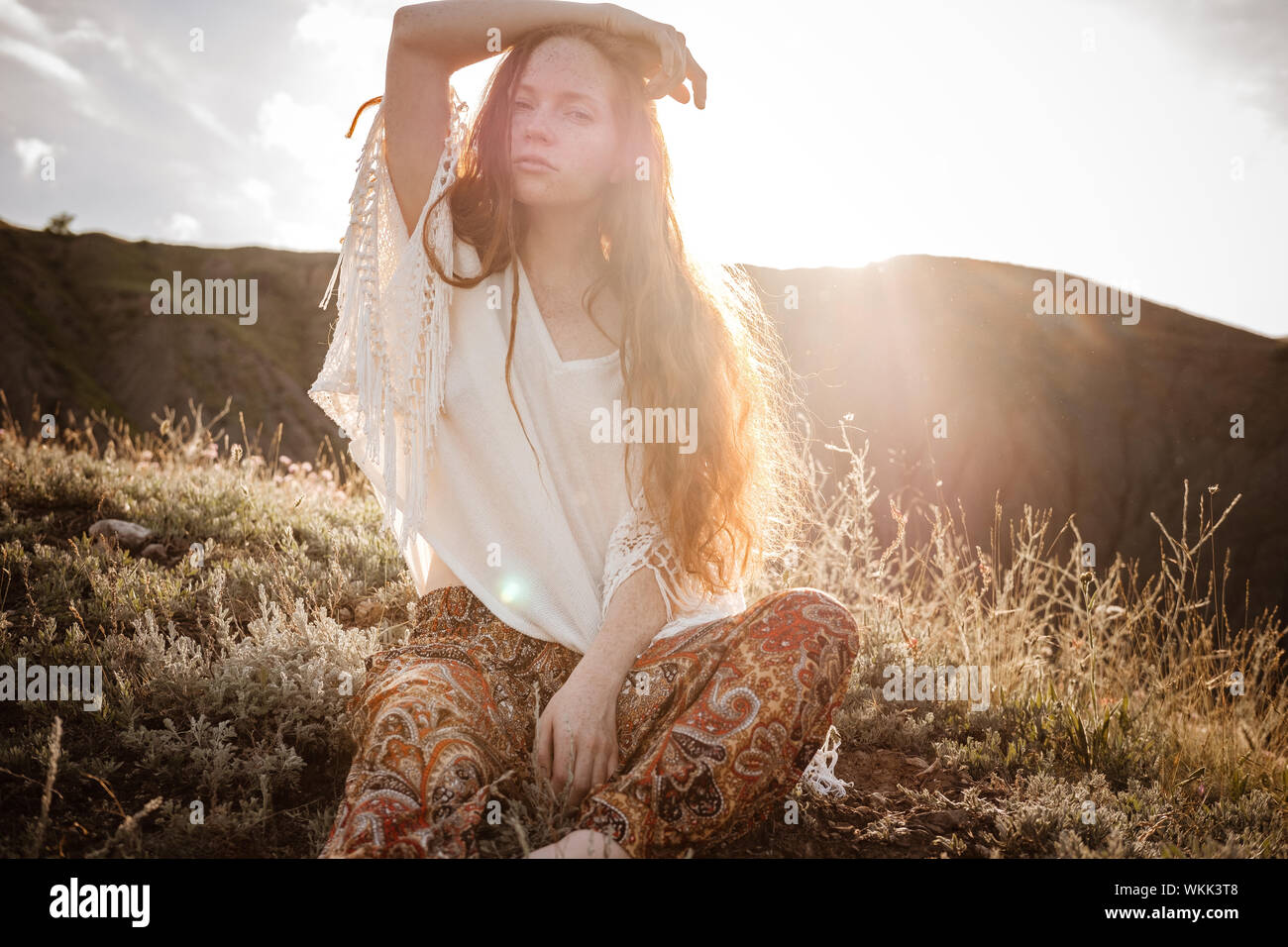 Beautiful hippie young beautiful woman with red hair dressed in boho ...